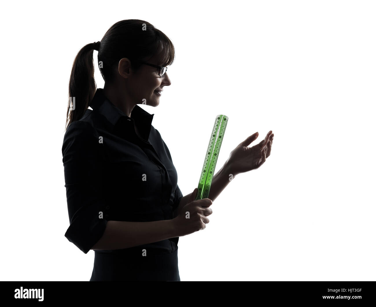 one business woman teacher holding ruler silhouette studio isolated on ...