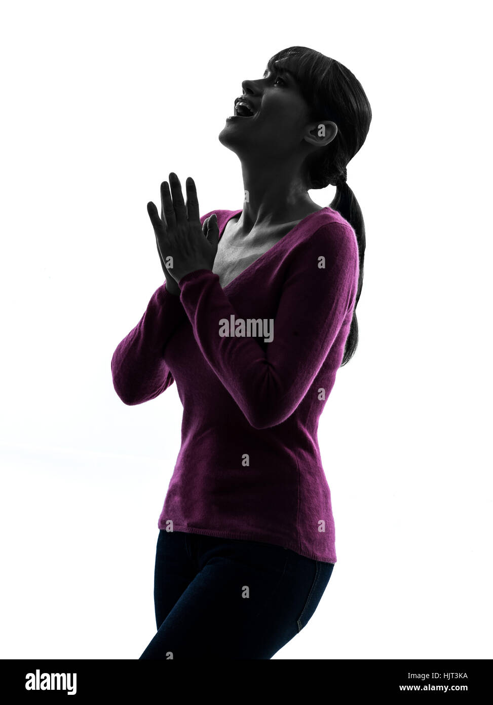 one caucasian woman surprised looking up portrait in silhouette studio ...