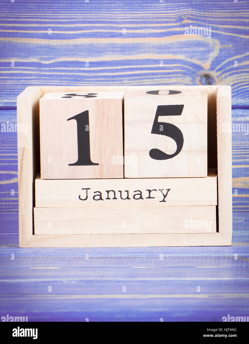 January 15th. Date of 15 January on wooden cube calendar, purple board ...