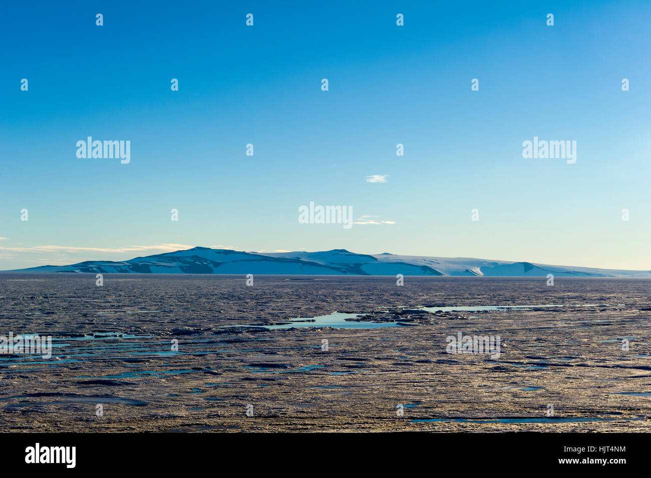 The slushy and fractured surface of sea ice melting in the Antarctic ...