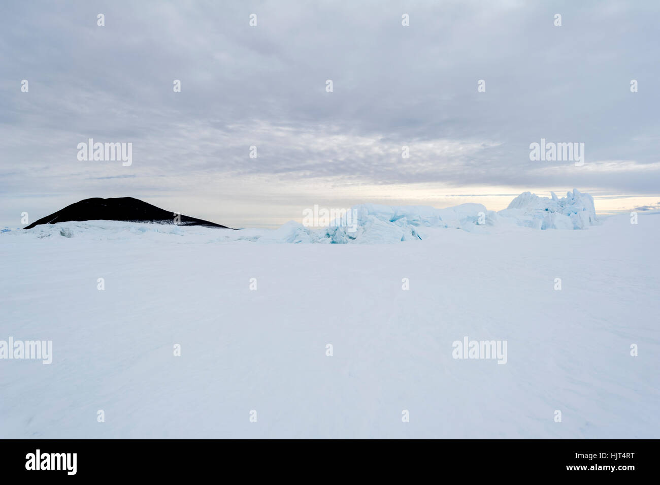 Fractured ice blocks pushed skywards along pressure ridges in the sea ...