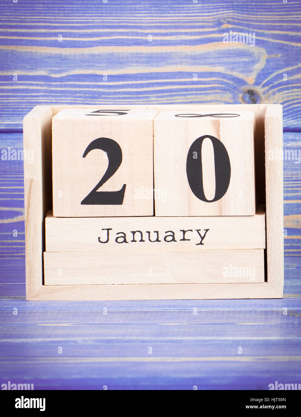 January 20th. Date of 20 January on wooden cube calendar, purple board ...