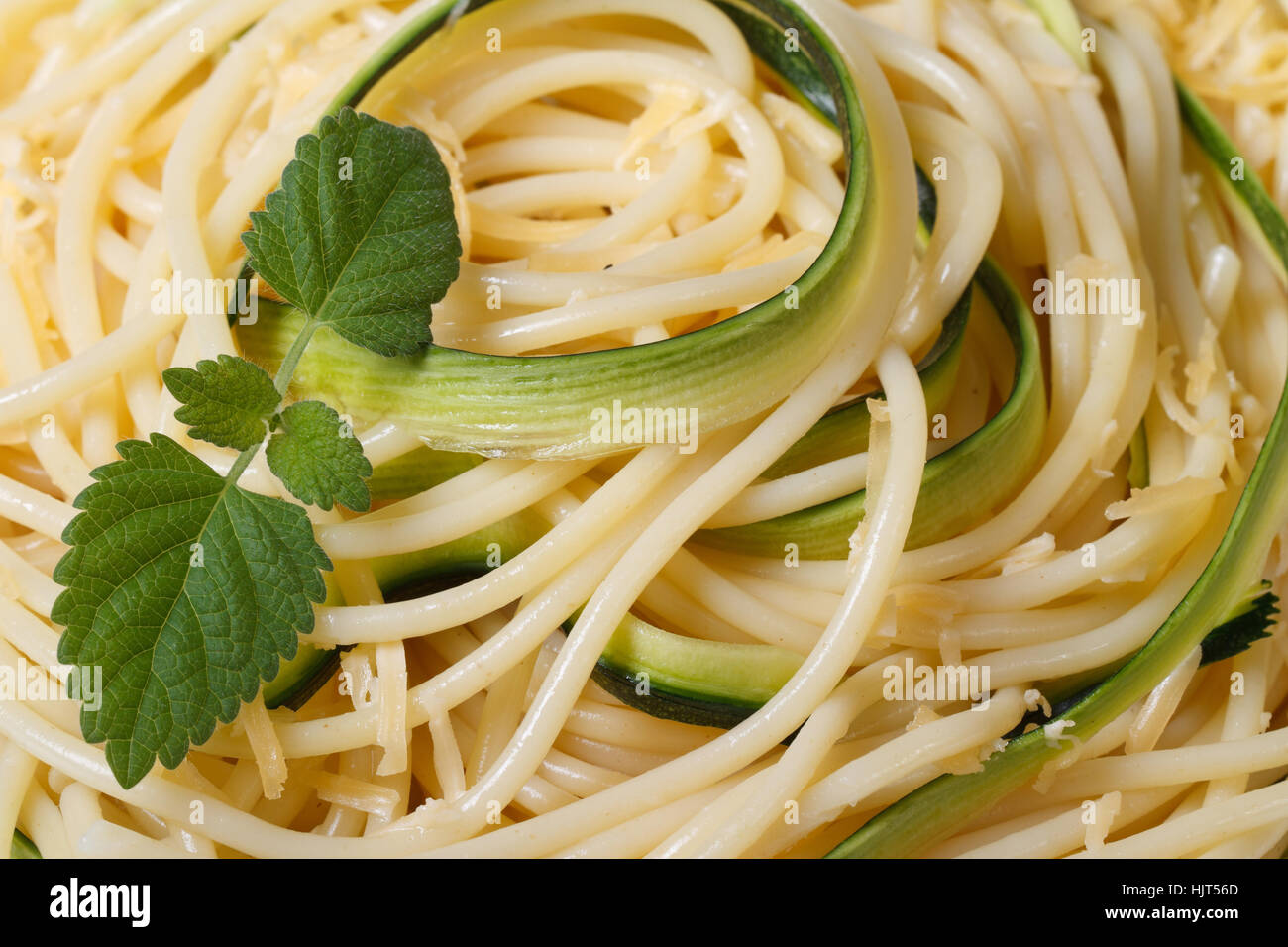 background spaghetti pasta with zucchini and mint close-up horizontal ...