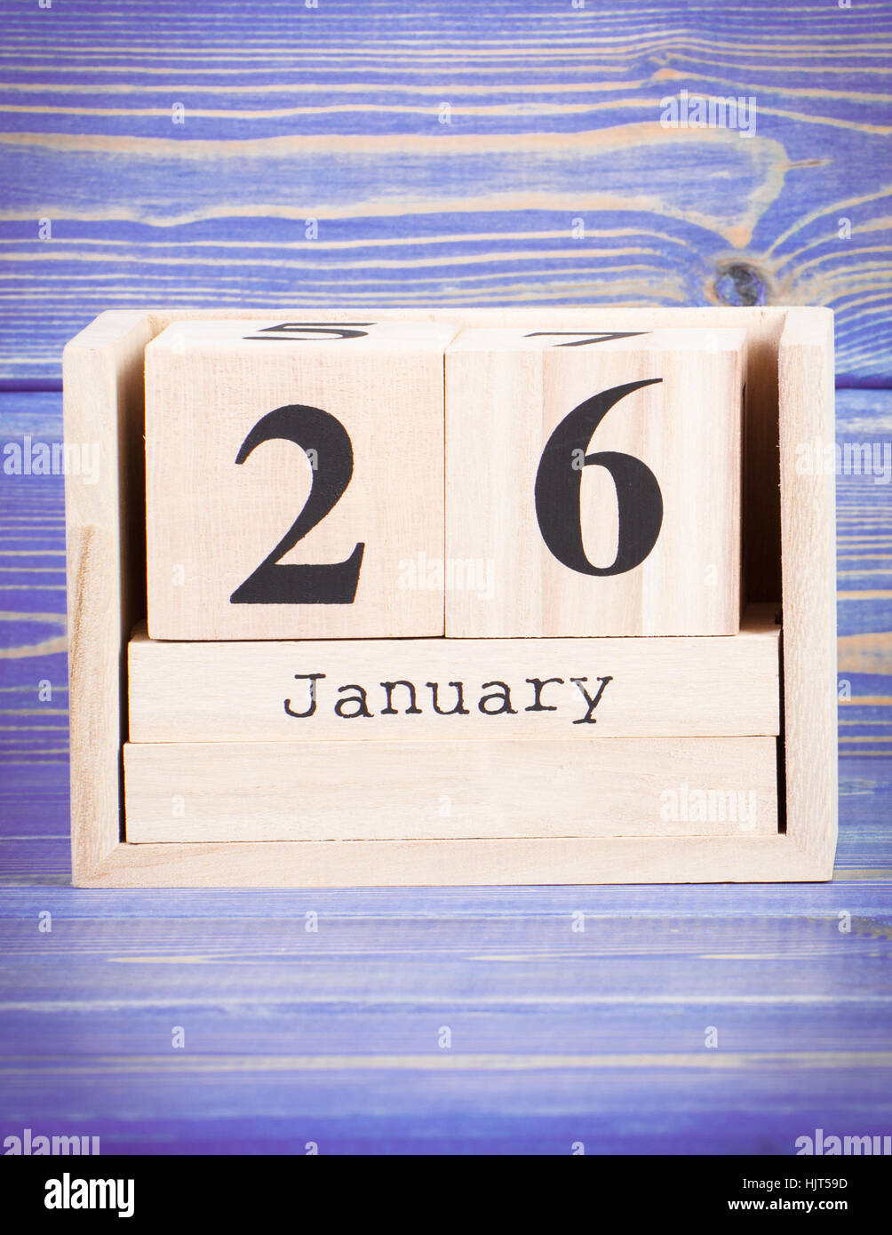 January 26th. Date of 26 January on wooden cube calendar, purple board ...