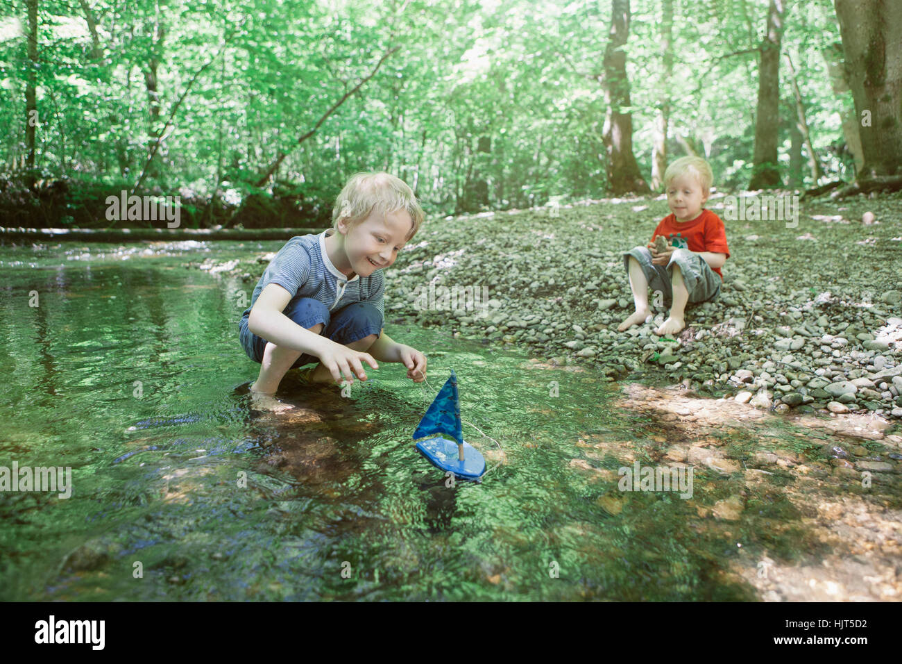 Boys with toy boat hi-res stock photography and images - Alamy