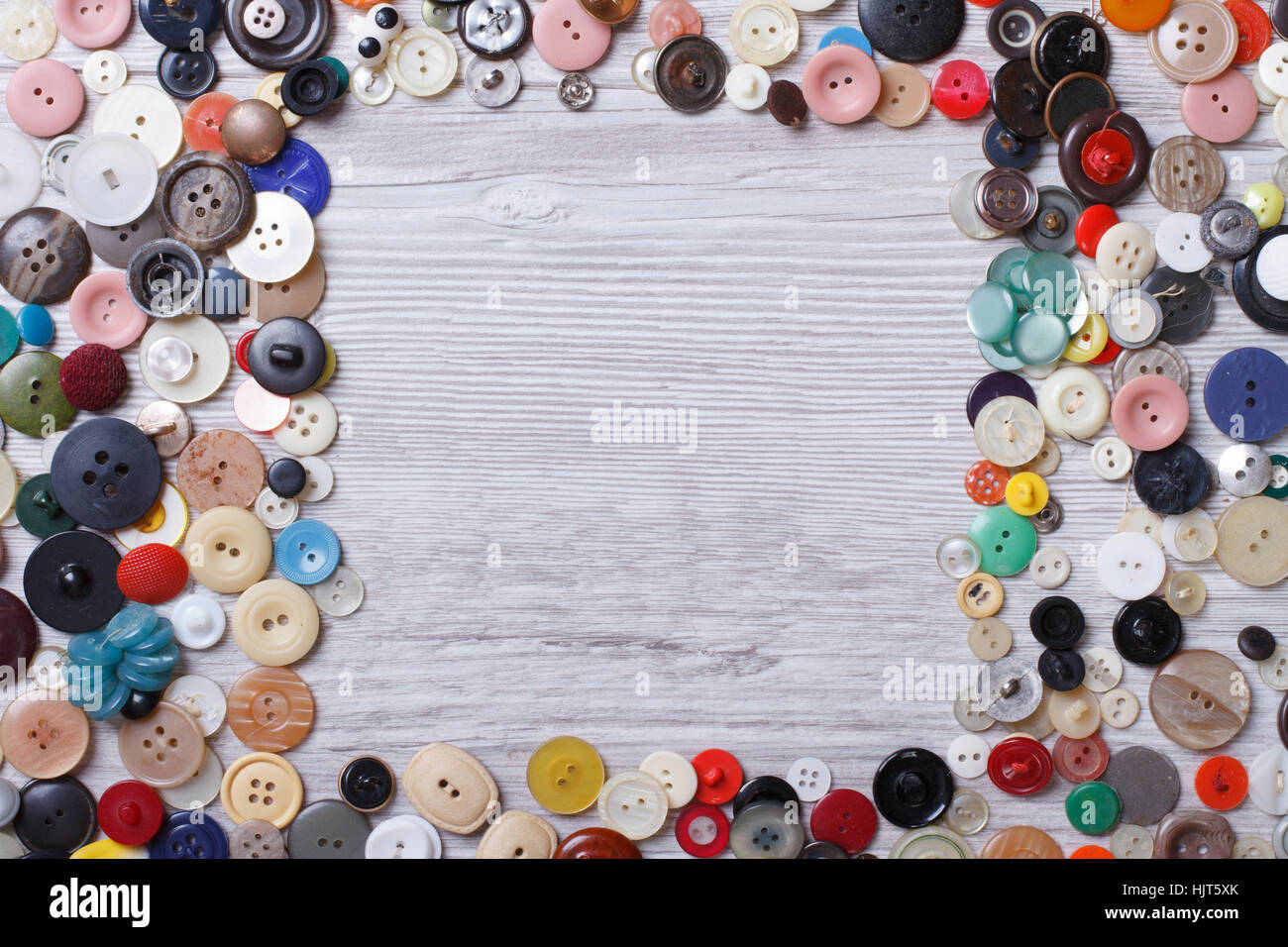 Frame of old buttons on wooden background close-up horizontal view from ...