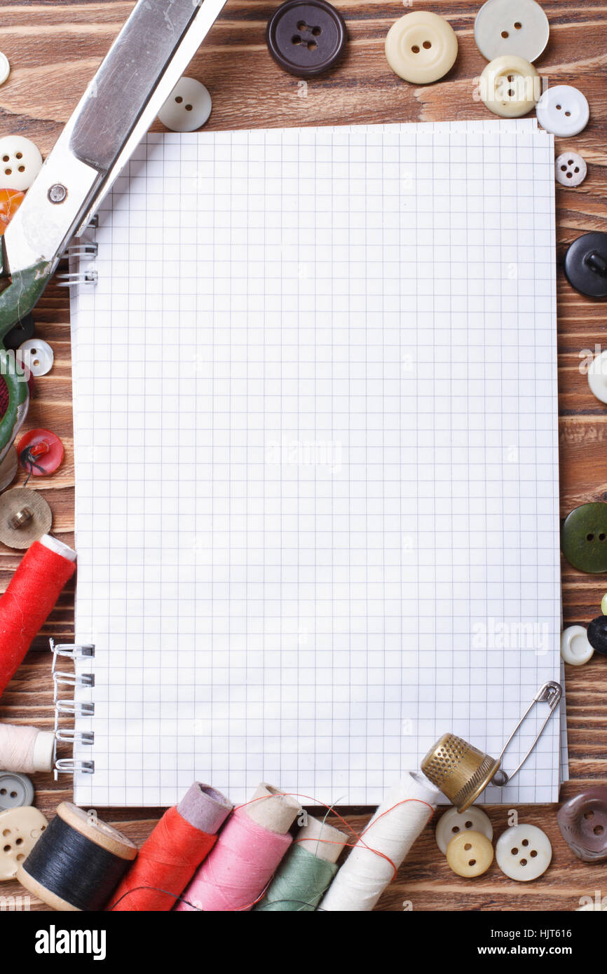 Background of sewing: scissors, thread, buttons, measuring tape and ...