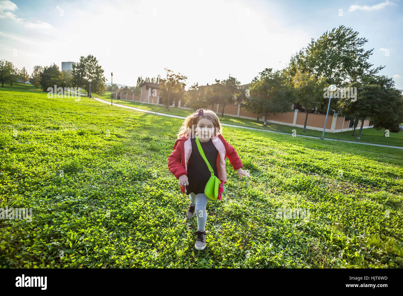 girl child running in the park Stock Photo - Alamy