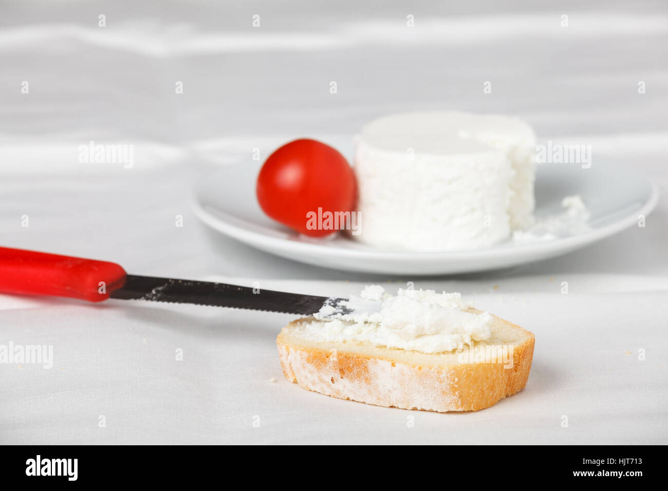 Italian goat cheese specialty on a slice of bread Stock Photo - Alamy