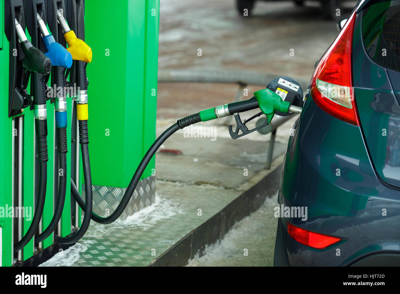 Car refueling on a petrol station in winter closeup Stock Photo - Alamy