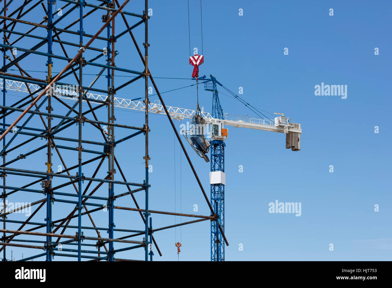 Construction crane and scaffold on construction site Stock Photo - Alamy