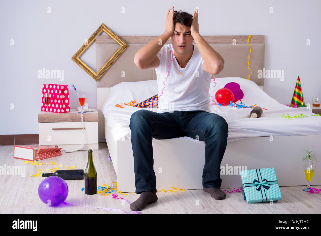 Man at home after heavy partying Stock Photo - Alamy