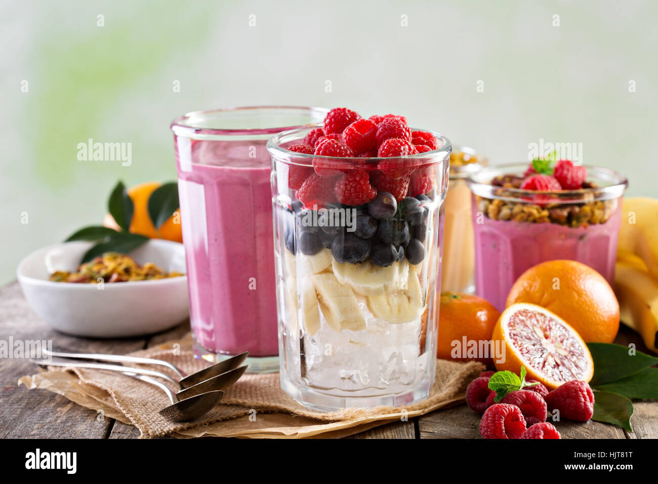 Berry smoothie ingredients in tall glass Stock Photo - Alamy