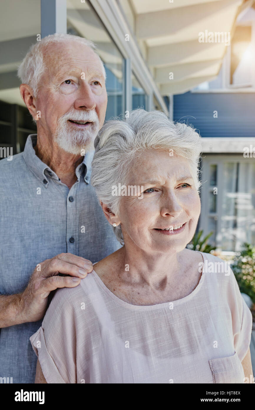 Senoir couple standing in their home, looking confident Stock Photo - Alamy