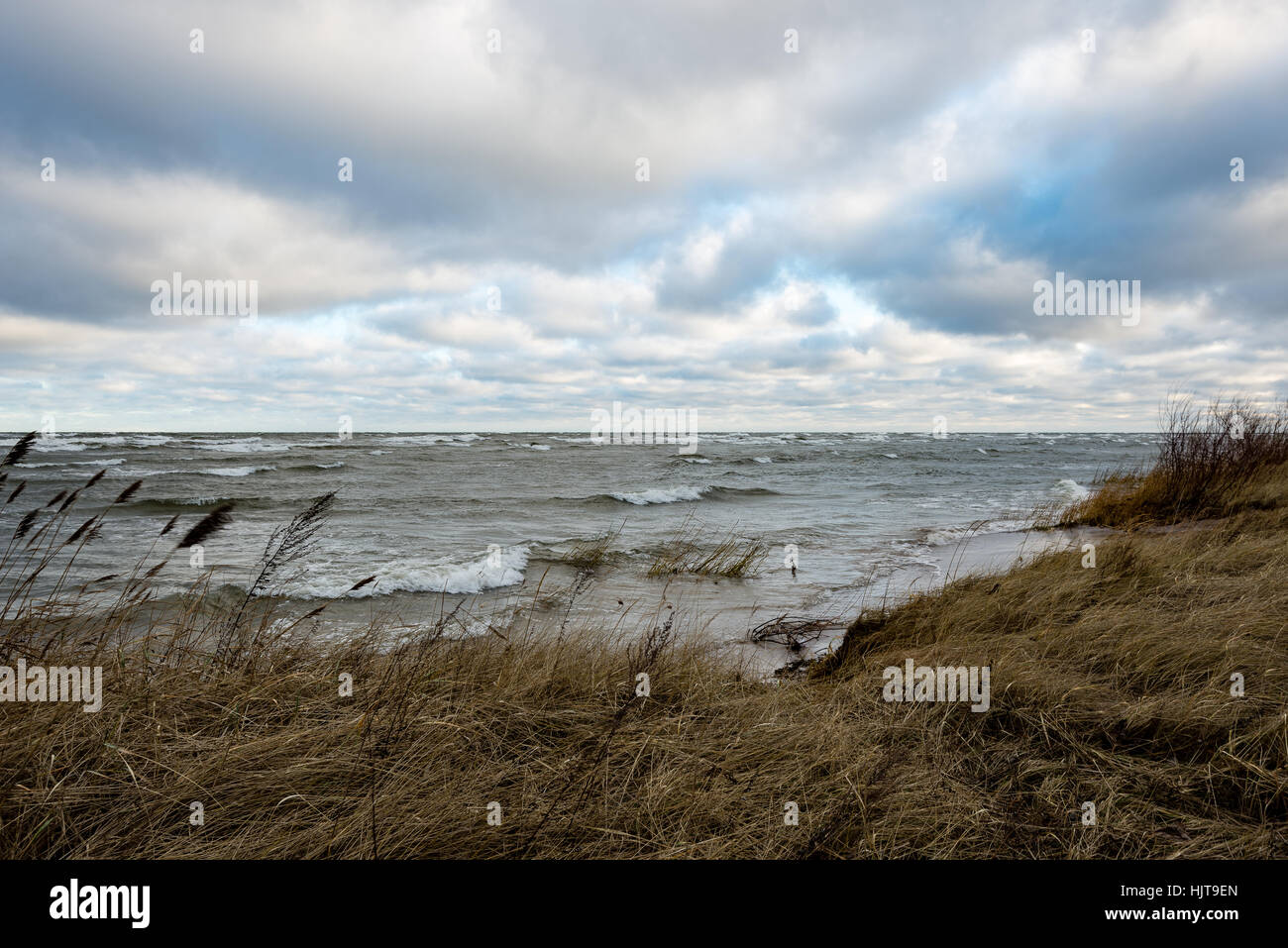 rocky sea beach with wide angle perspective over the sea clouds Stock ...
