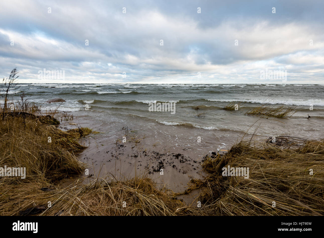rocky sea beach with wide angle perspective over the sea clouds Stock ...