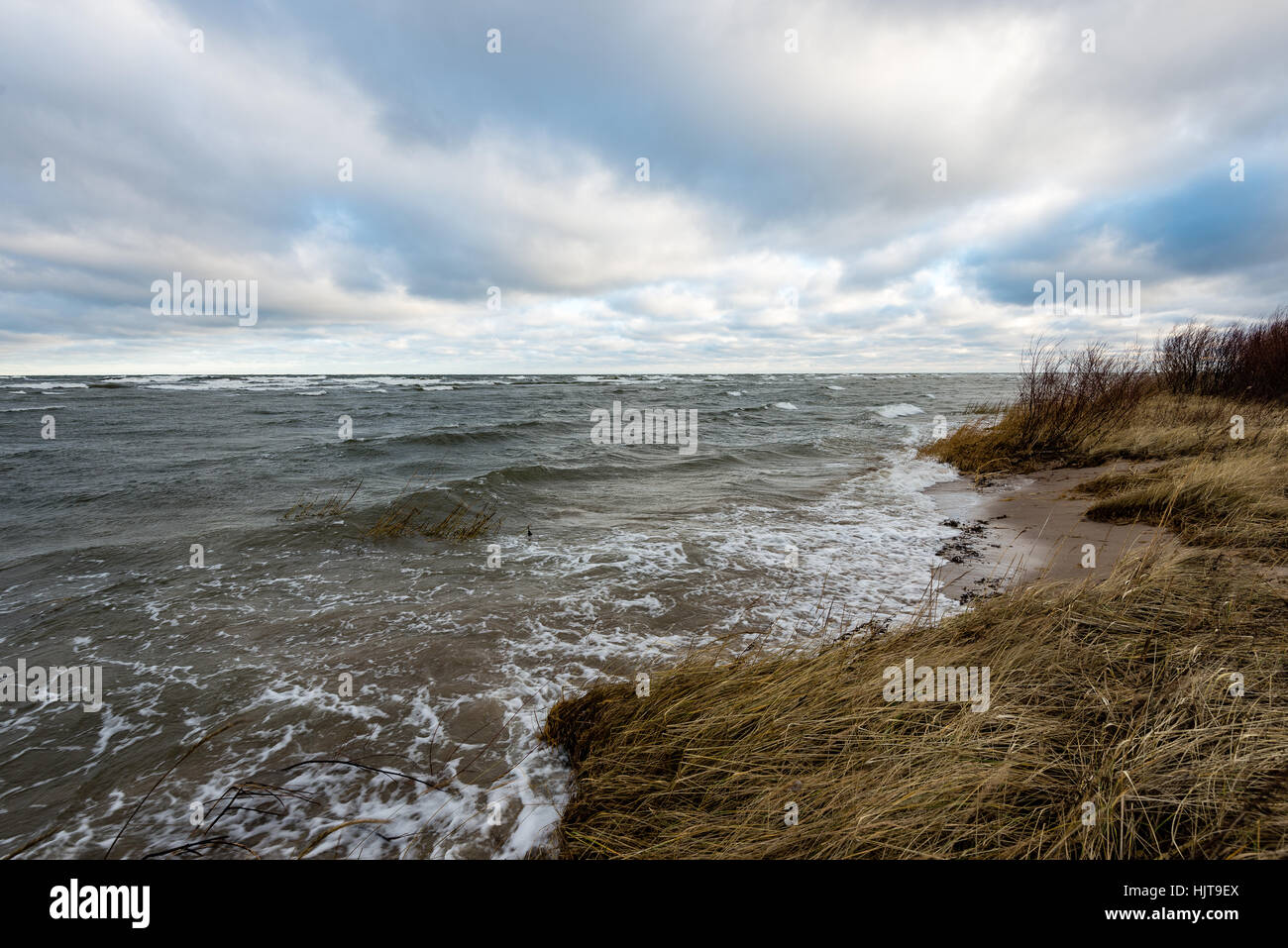 rocky sea beach with wide angle perspective over the sea clouds Stock ...