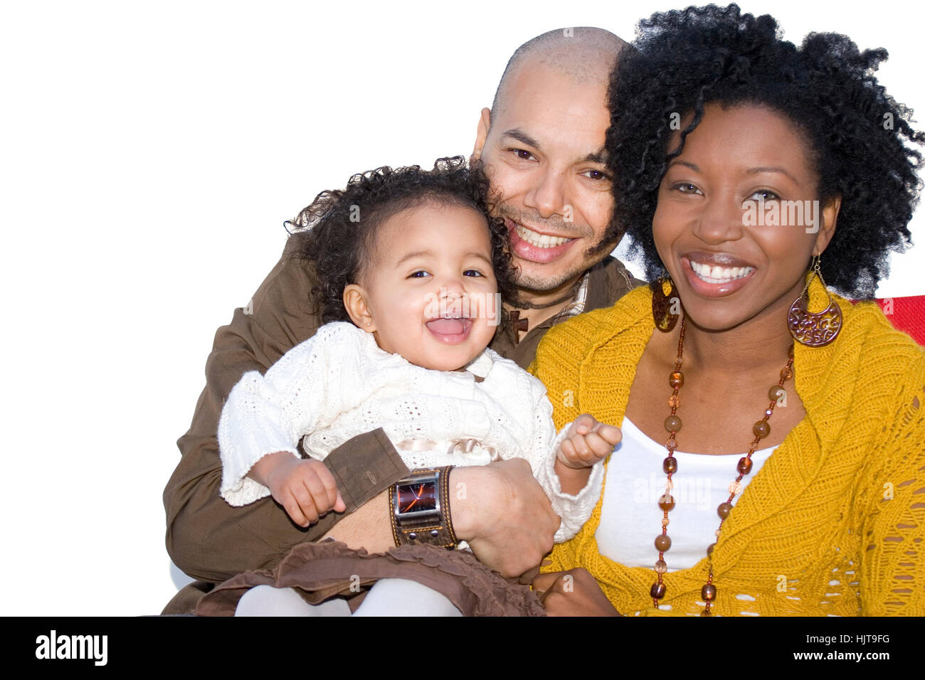 Loving multicultural parents and their daughter smiling Stock Photo - Alamy