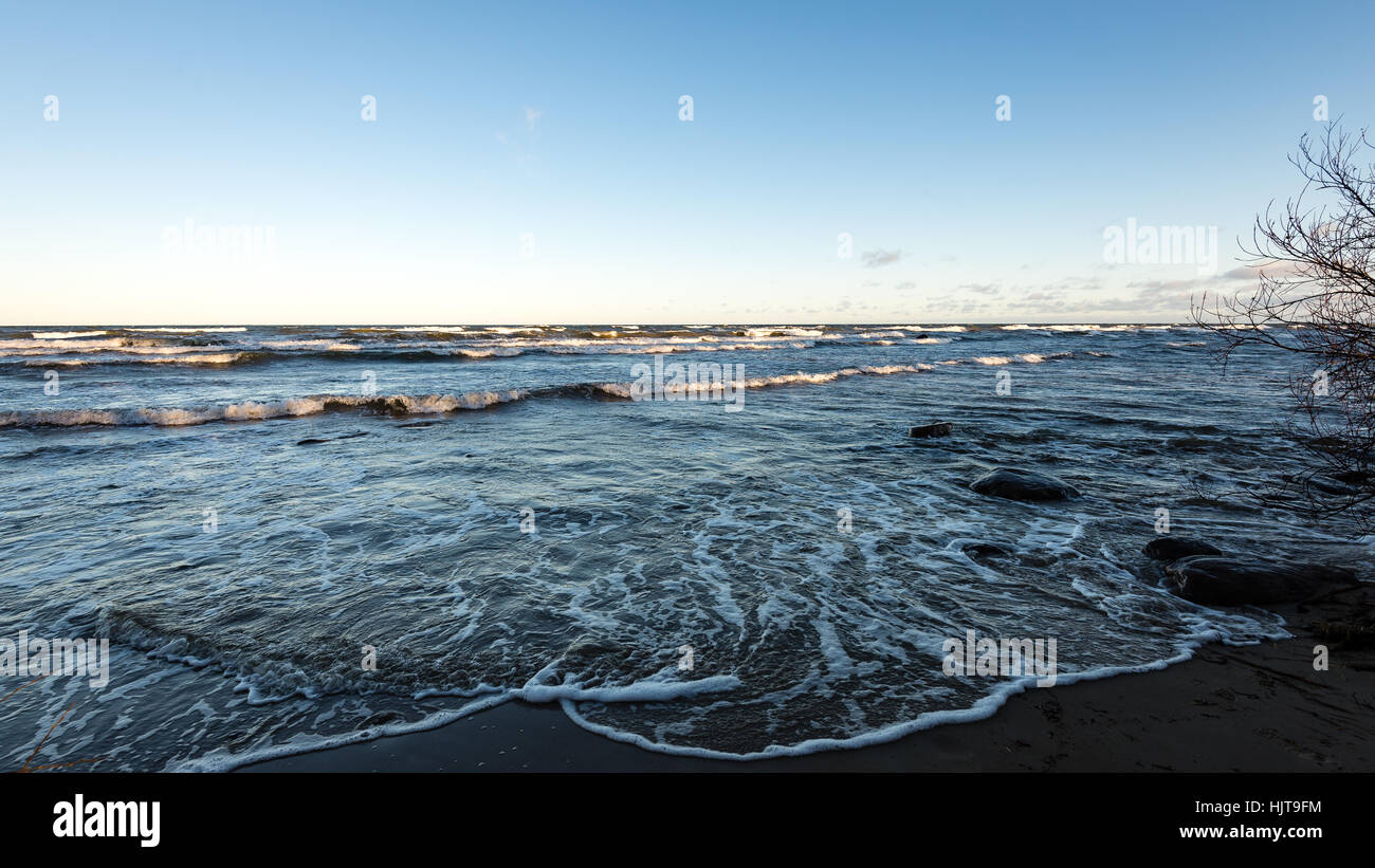 rocky sea beach with wide angle perspective over the sea clouds Stock ...