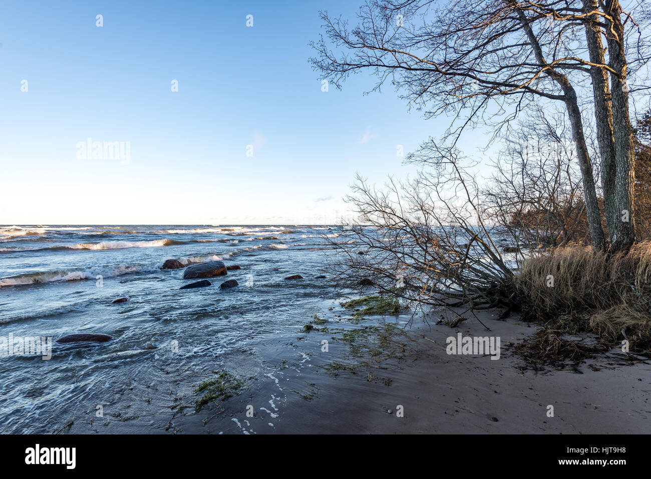 rocky sea beach with wide angle perspective over the sea clouds Stock ...