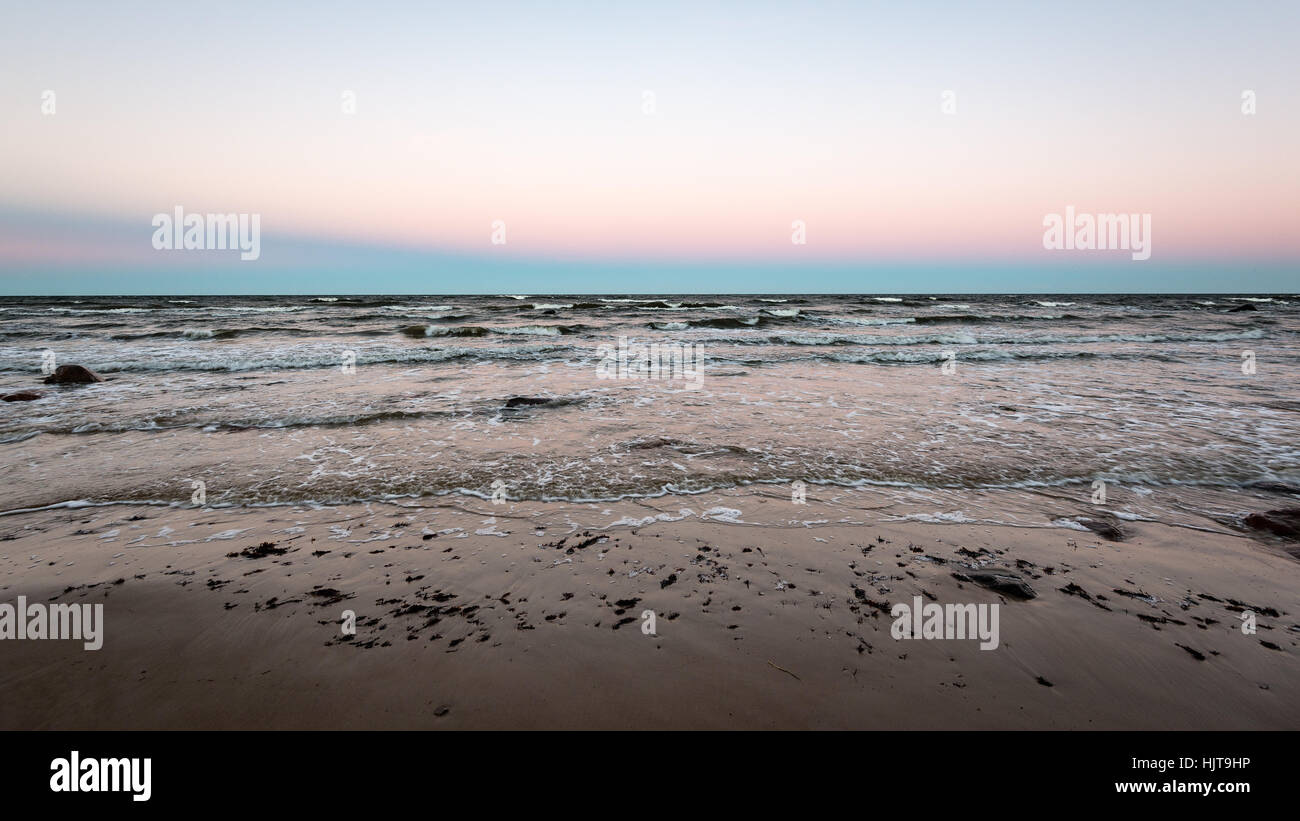 rocky sea beach with wide angle perspective over the sea clouds Stock ...