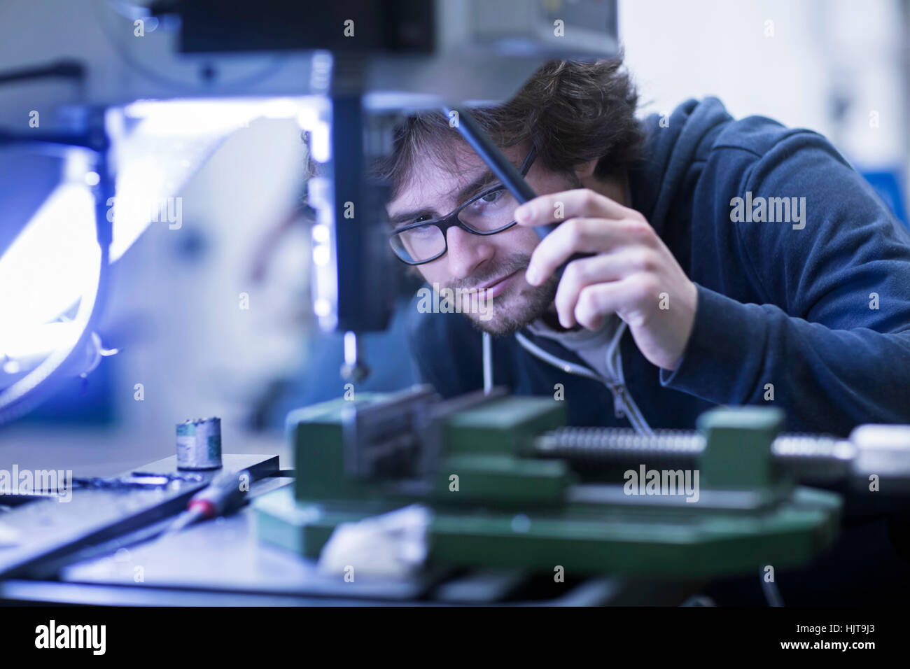 Man at work in a factory Stock Photo - Alamy