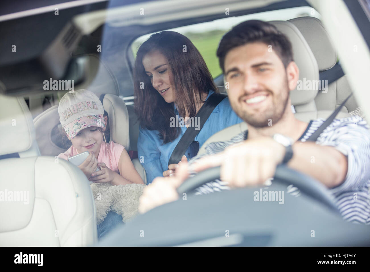 Happy family doing a road trip Stock Photo - Alamy