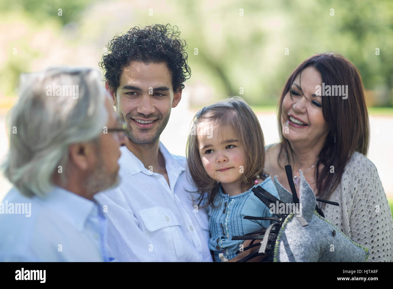 Smiling extended family outdoors Stock Photo - Alamy