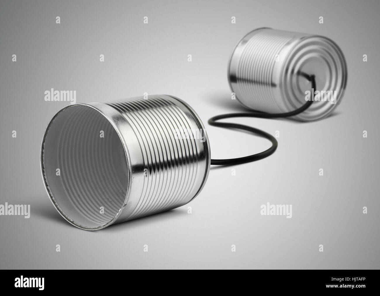 Tin can telephone with cord on grey, telephony concept Stock Photo - Alamy