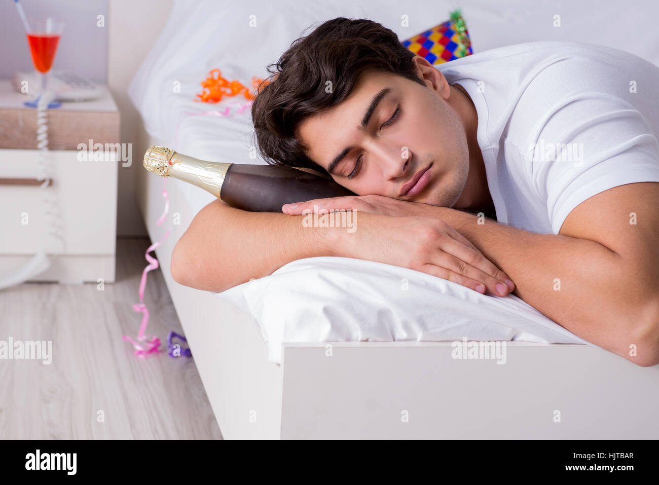 Man at home after heavy partying Stock Photo - Alamy