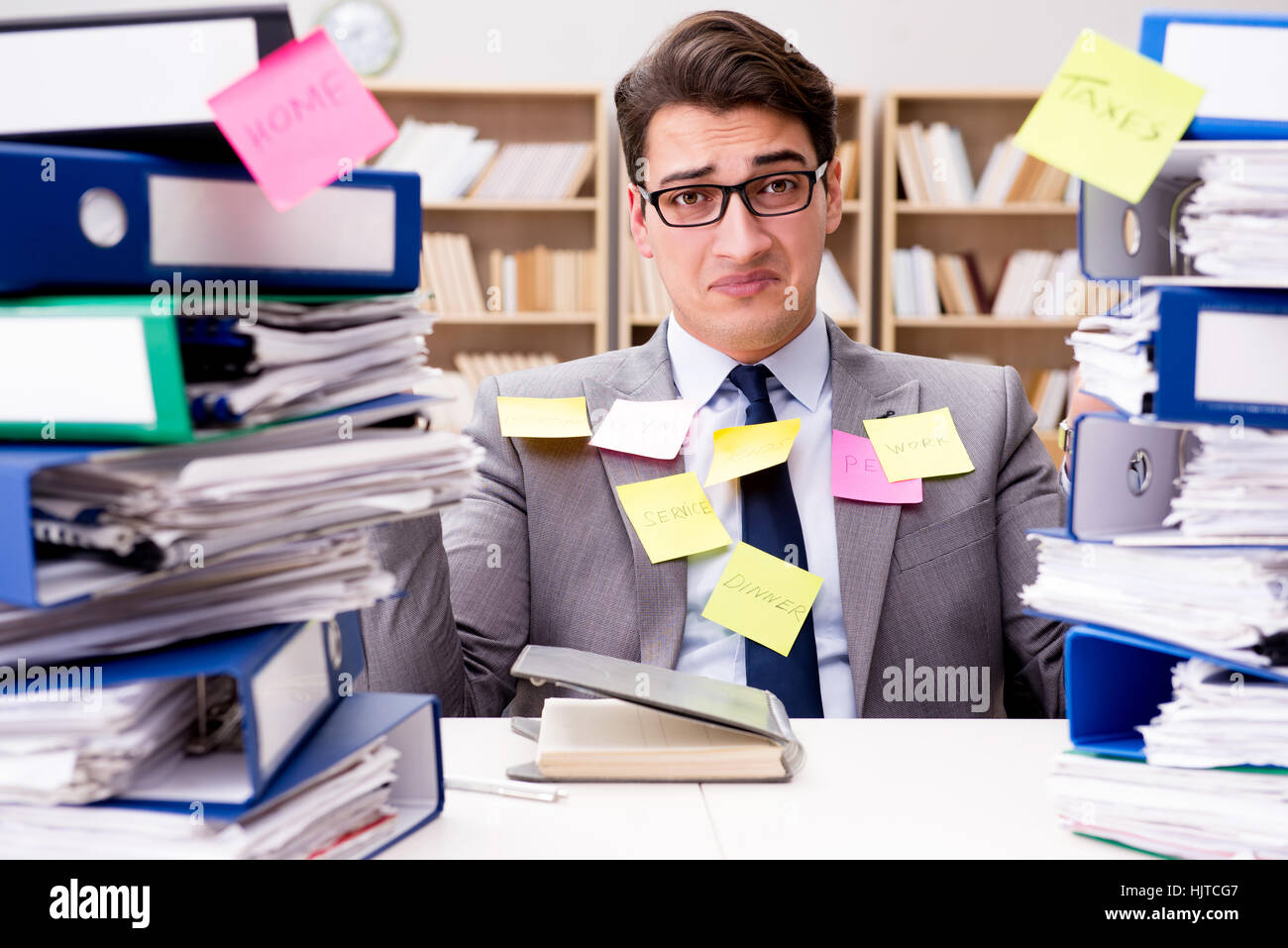 Businessman struggling with multiple priorities Stock Photo - Alamy