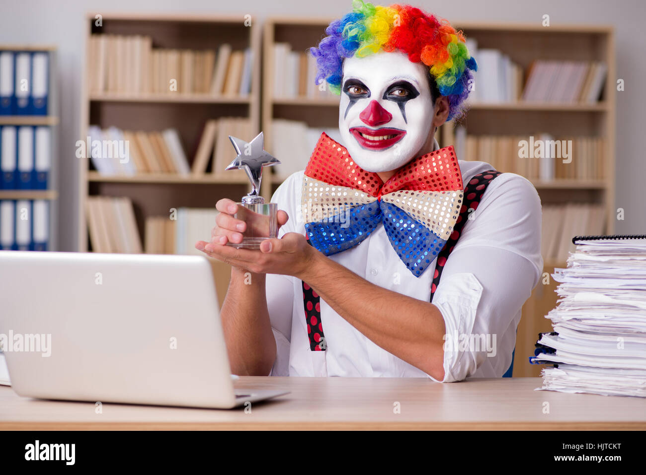 Clown businessman working in the office Stock Photo - Alamy