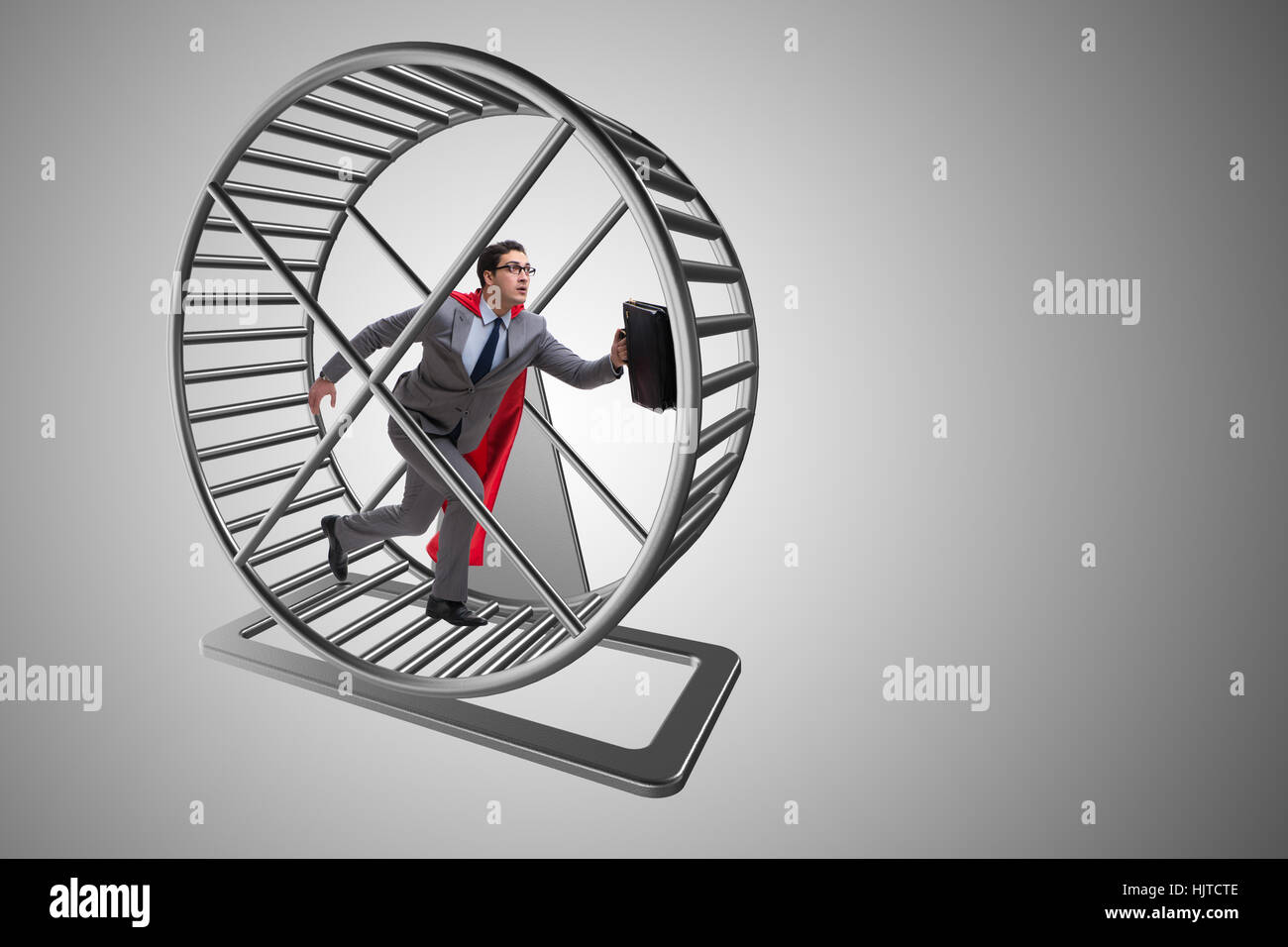 Businessman running on hamster wheel Stock Photo - Alamy