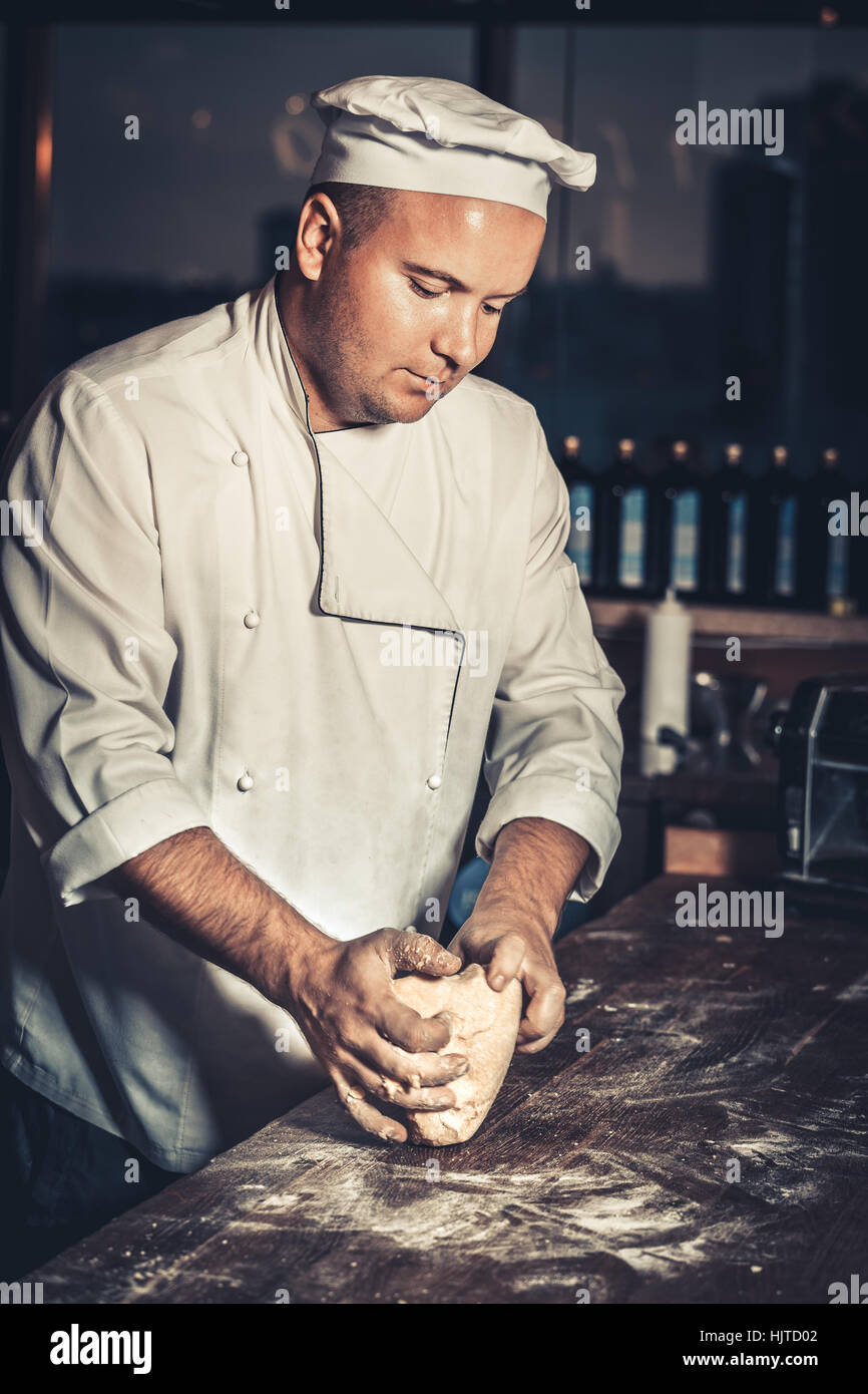 Busy chef at work in the restaurant kitchen Stock Photo - Alamy