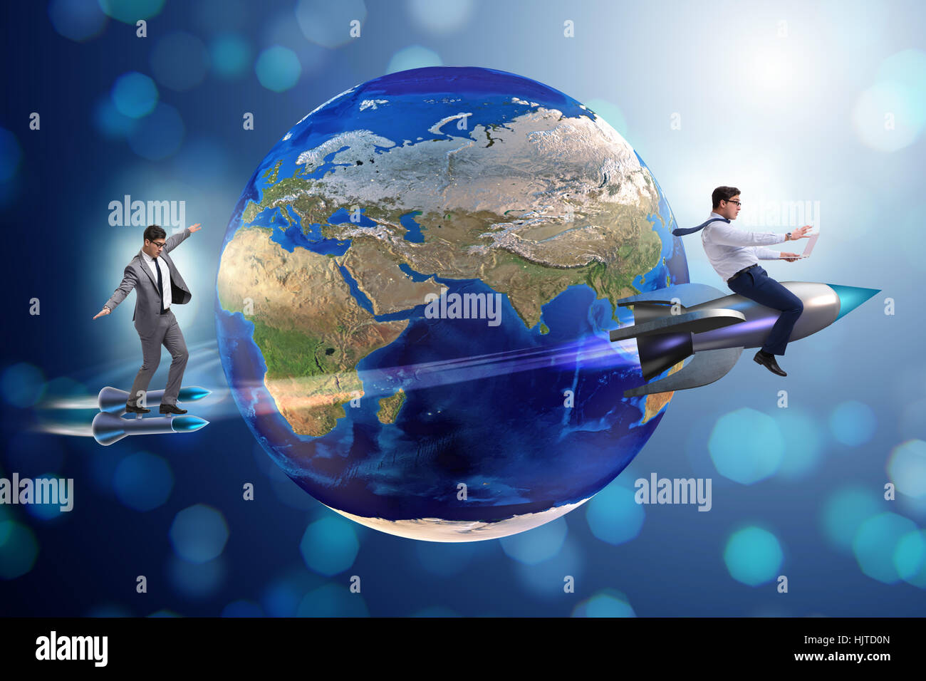 Two businessmen chasing around globe Stock Photo - Alamy