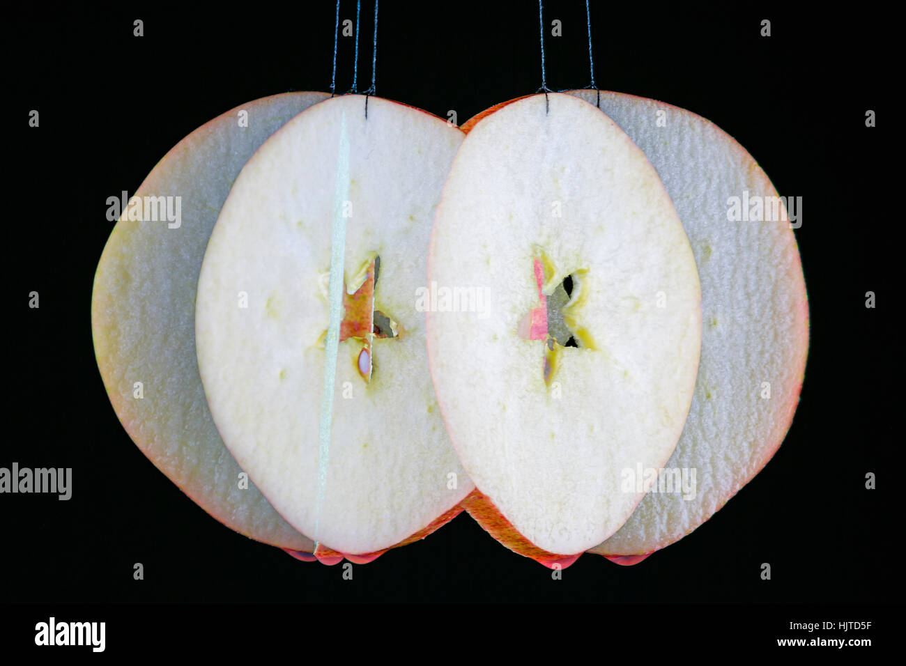 Slice of apple. Multiple exposure. Action image Stock Photo - Alamy