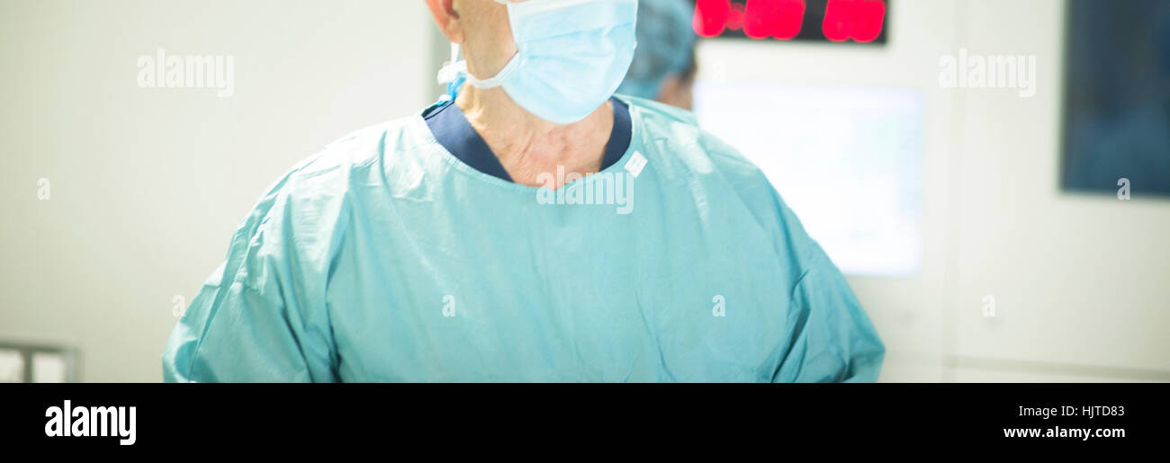 Surgeon in hospital surgery in sterile uniform "scrubs" in operating ...