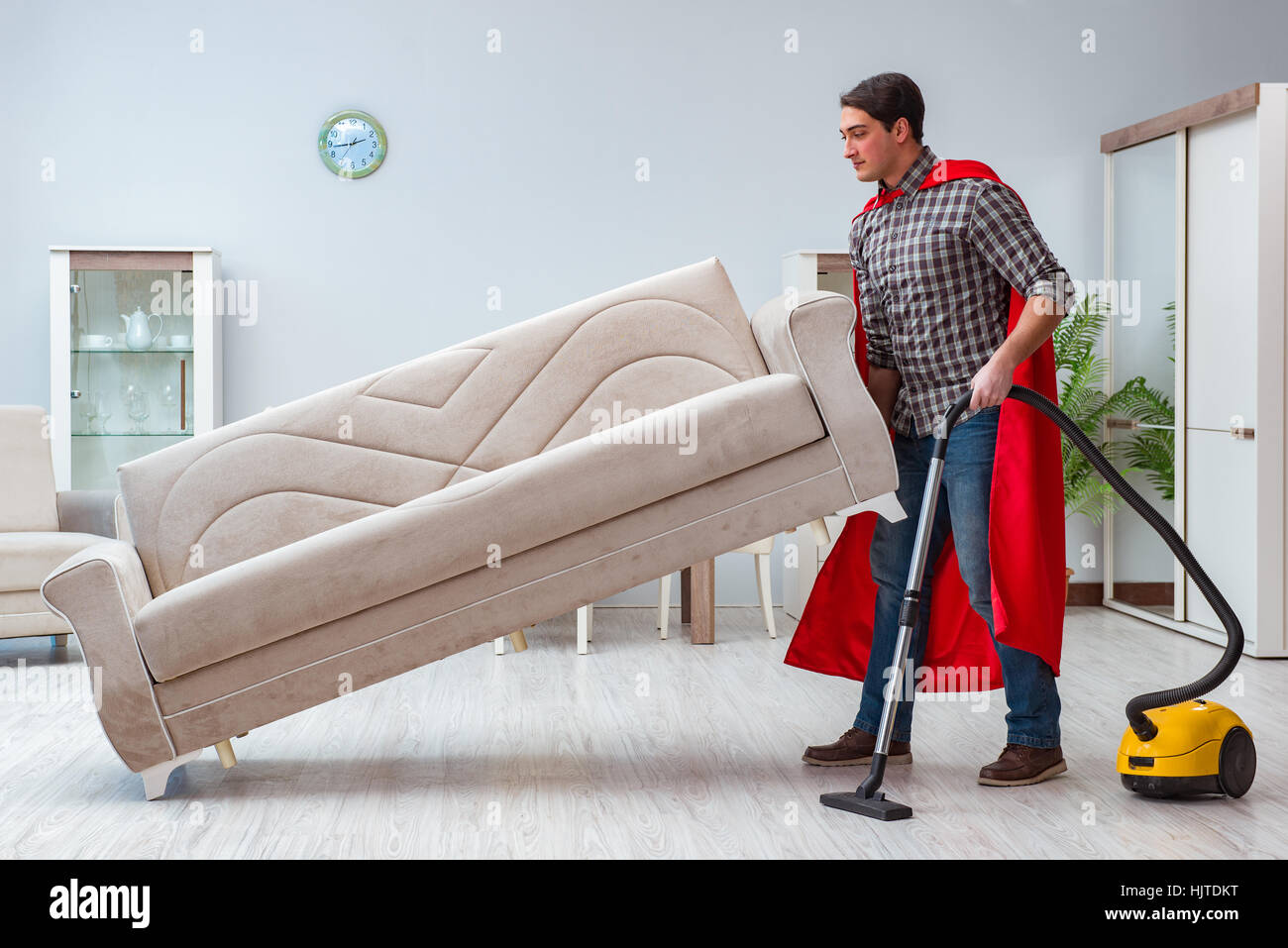 Super hero cleaner working at home Stock Photo - Alamy