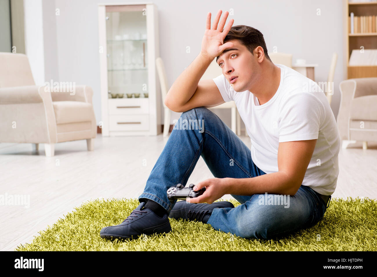 Man addicted to computer games Stock Photo - Alamy