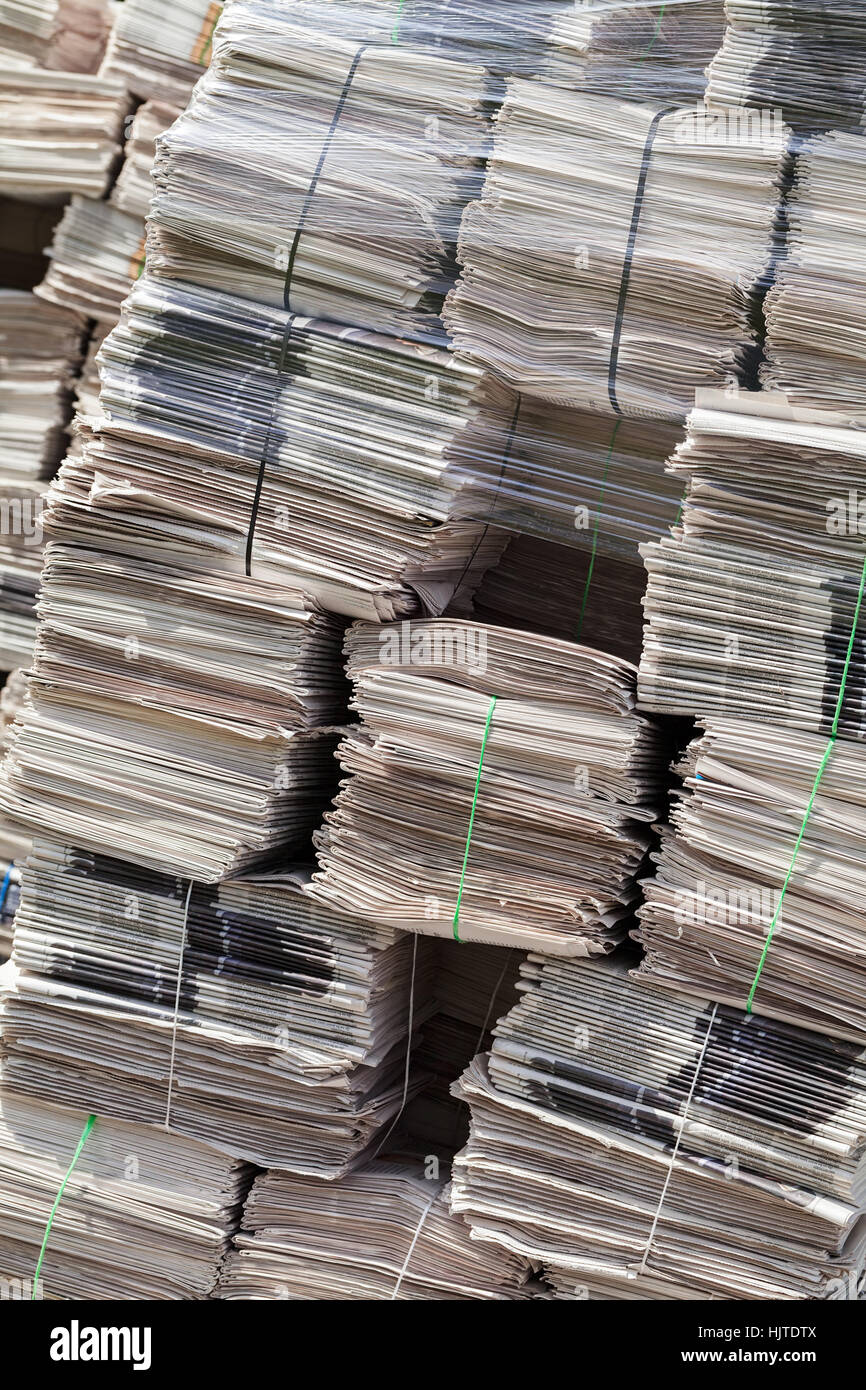 Pile of newspapers in white background hi-res stock photography and ...
