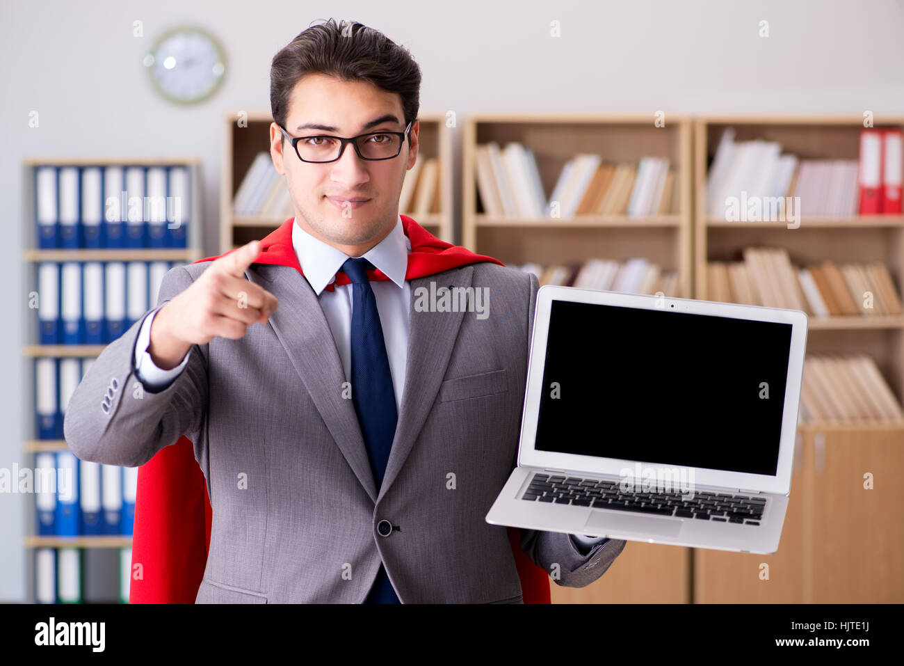 Superhero businessman working in the office Stock Photo - Alamy