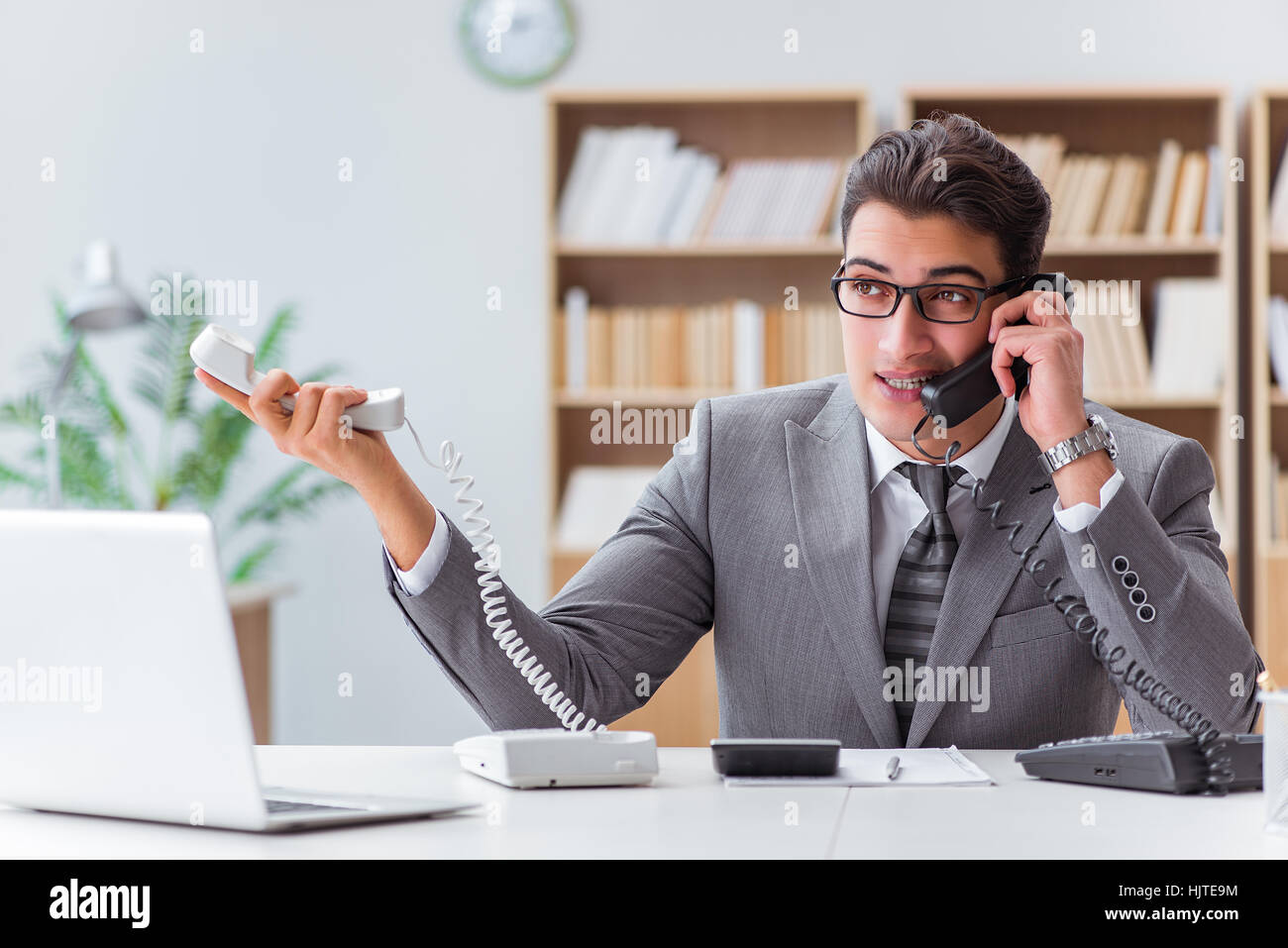 Angry helpdesk operator in the office Stock Photo - Alamy