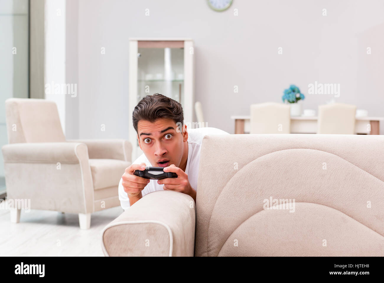 Man addicted to computer games Stock Photo - Alamy