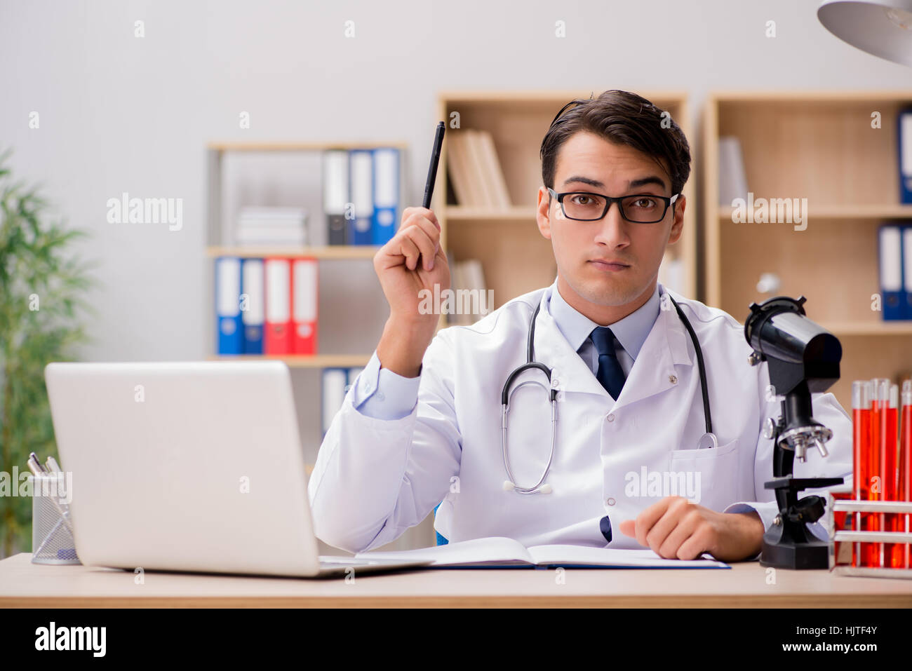 Young adult doctor working in the hospital Stock Photo - Alamy