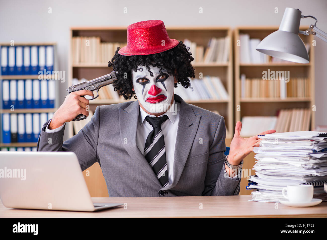 Clown businessman working in the office Stock Photo - Alamy