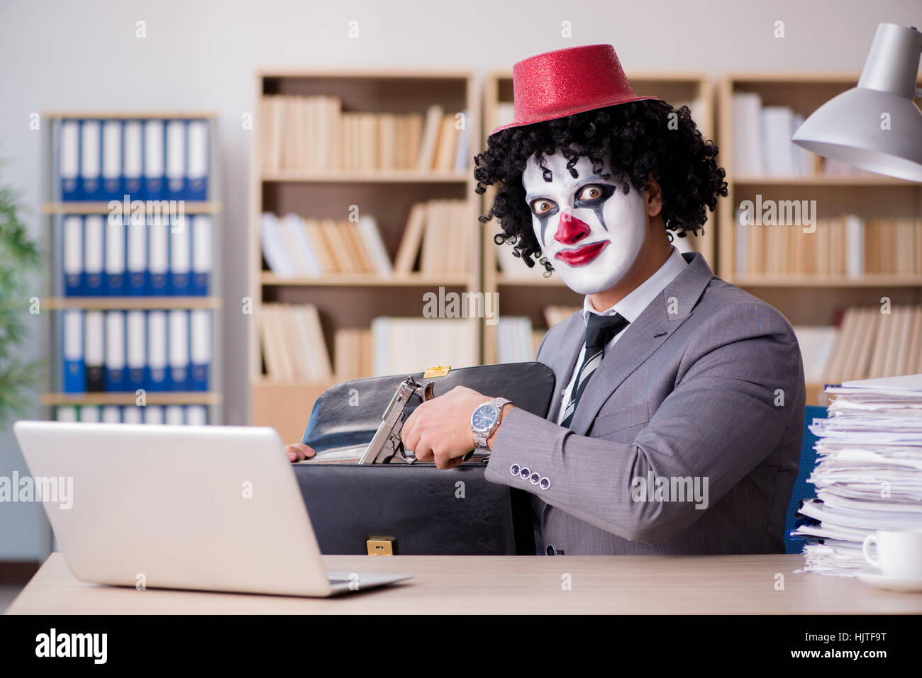Clown businessman working in the office Stock Photo - Alamy
