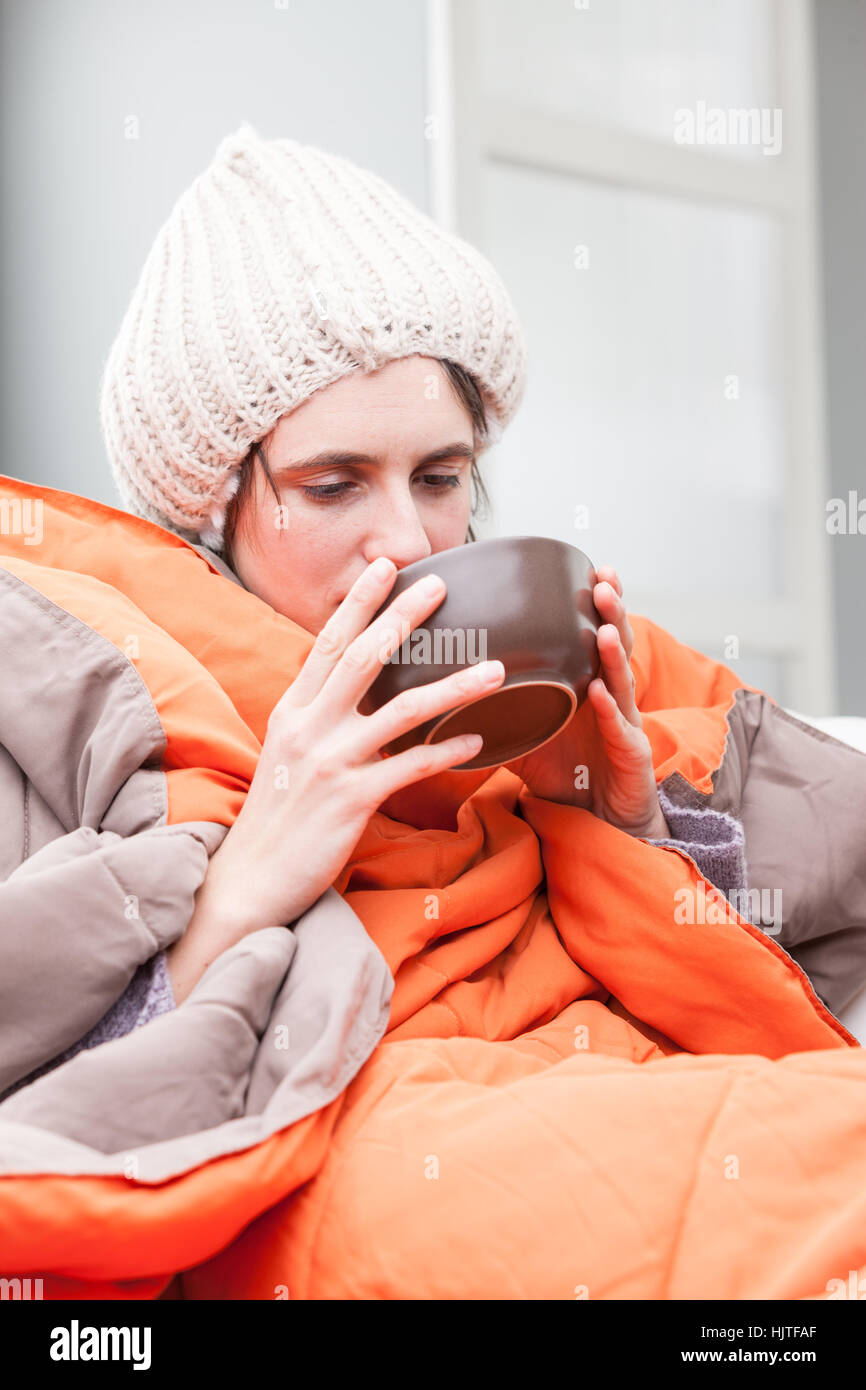 funny exaggeration concept of an ill woman that has the flu as she ...