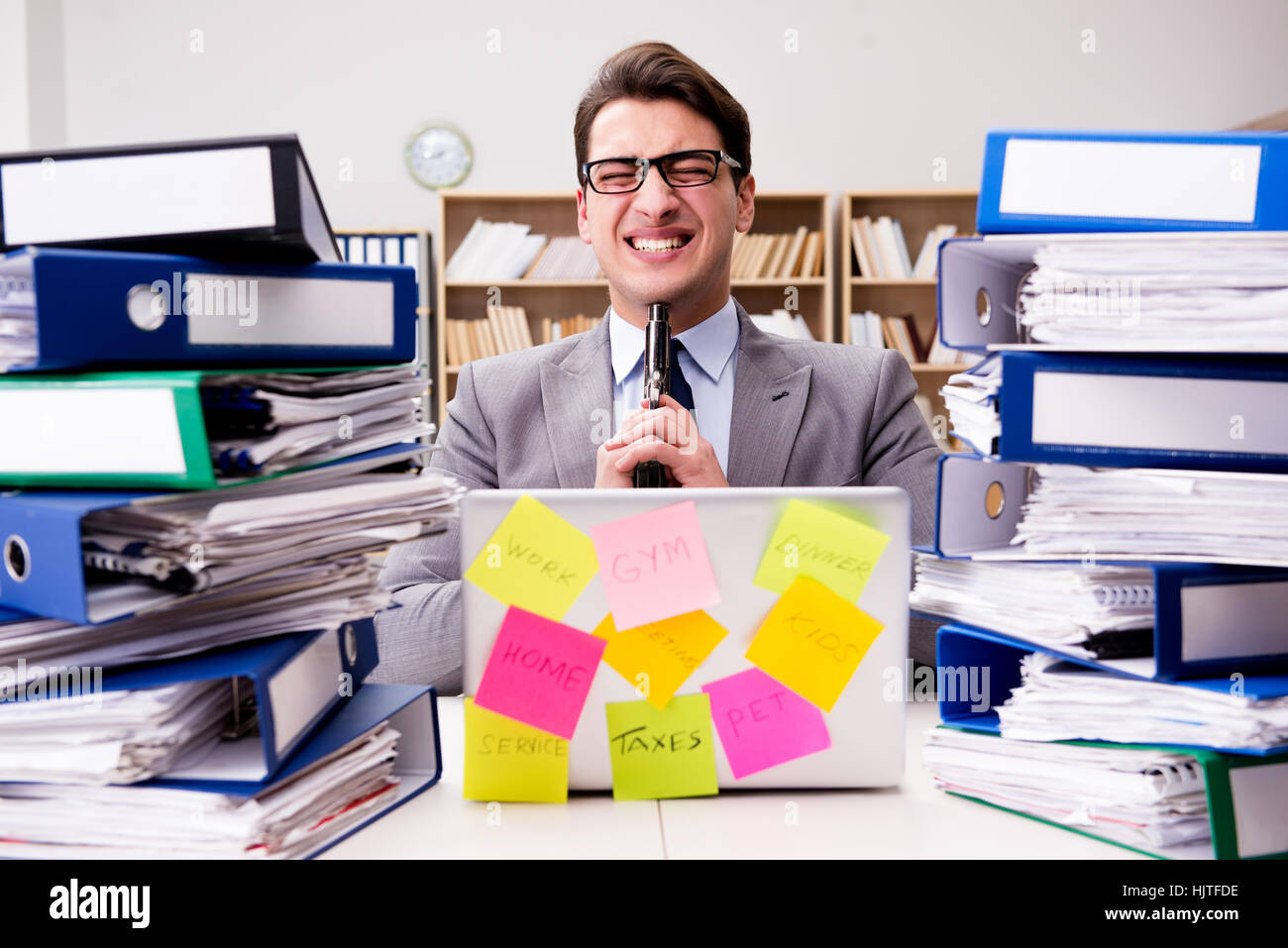 Businessman struggling with multiple priorities Stock Photo - Alamy