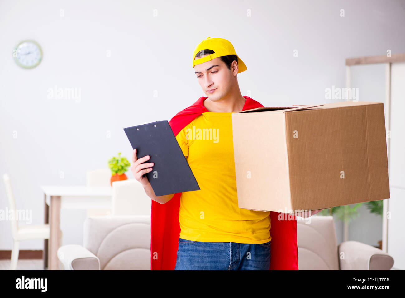 Superhero delivery guy with box Stock Photo - Alamy
