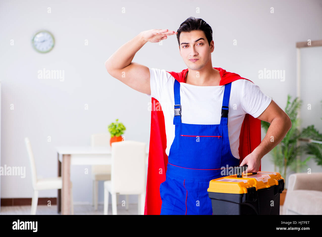 Superhero repairman with tools in repair concept Stock Photo - Alamy